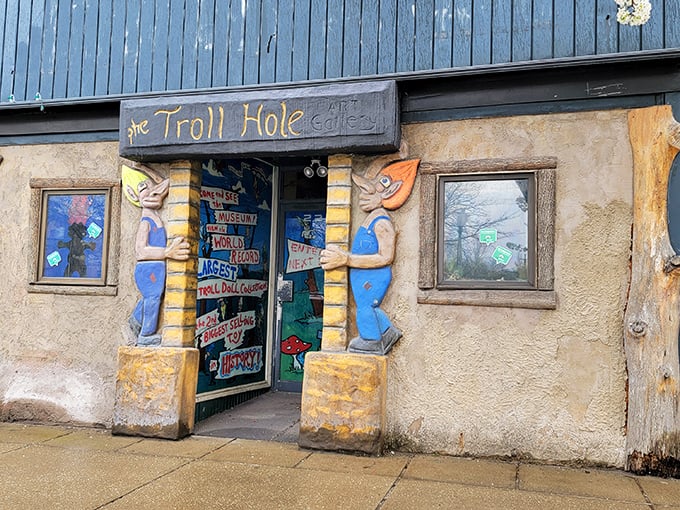 Troll Hole Museum: Two colorful troll guardians flank the entrance, inviting visitors into a world where "under the bridge" means pure whimsy.