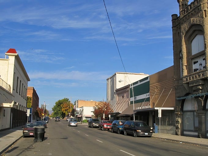 Main Street magic! Weiser's historic buildings stand like sentinels of affordability, where your Social Security check stretches further than those autumn-kissed trees in the distance.