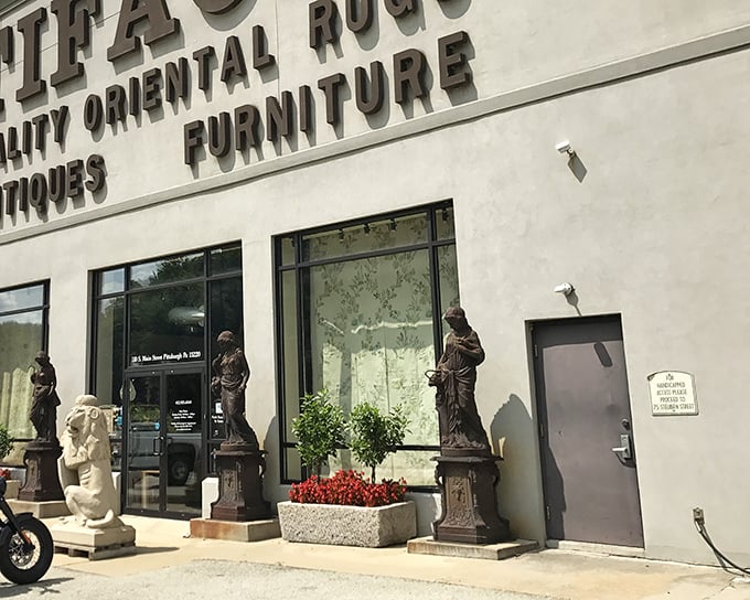 The elegant façade of Artifacts, where classical statues hint at the wonderland of vintage delights waiting just beyond those doors.