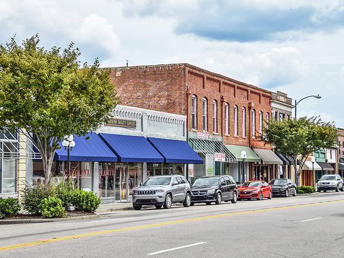 Classic brick storefronts line Main Street, where small-town charm meets practical living in perfect harmony.