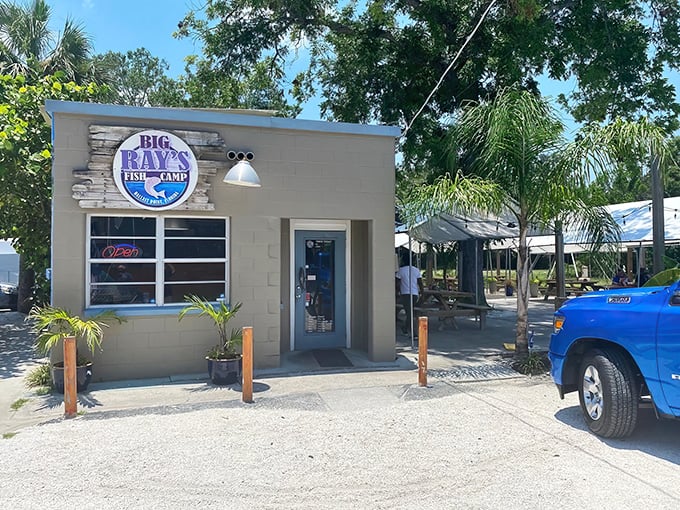 That bright green door isn't just an entrance – it's a portal to grouper sandwich nirvana that locals guard like a secret fishing spot.