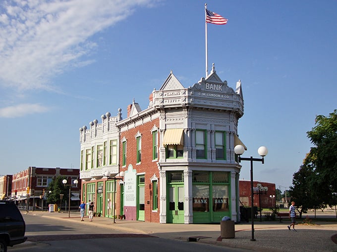 This isn't just a historic bank building—it's a monument to Coffeyville's affordable charm. The American flag waves proudly over budget-friendly living.