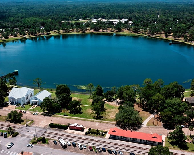 The pristine waters of DeFuniak Springs' lake reflect the town's charm—nature's mirror showing off Florida's hidden treasure.
