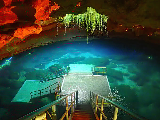 "Stairway to heaven? More like stairway to prehistoric paradise. The fiery orange cave walls make this blue spring look like it was designed by Mother Nature's most artistic child."