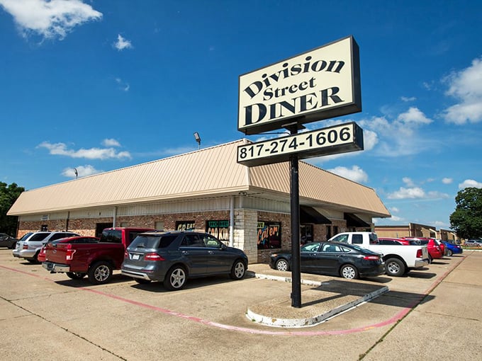 That classic diner sign against blue skies promises the kind of breakfast that makes you forget about fancy chain restaurants.