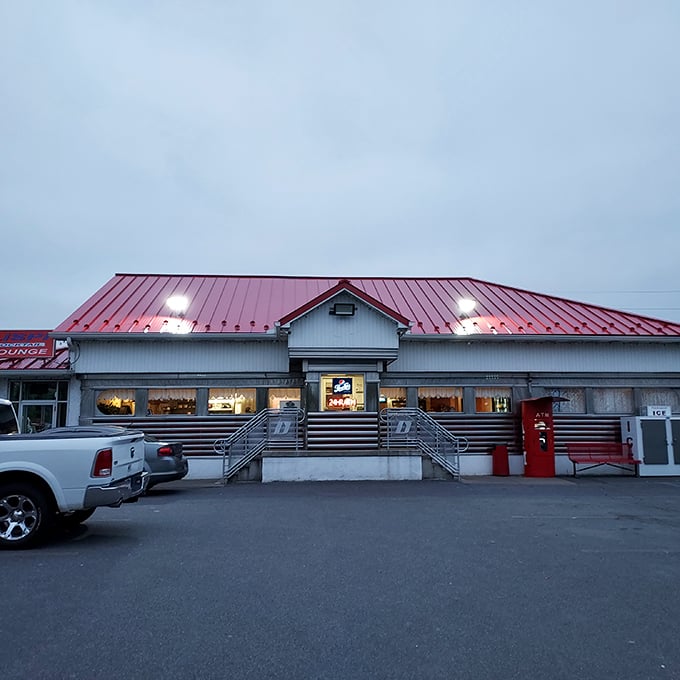 Evening glow transforms this roadside gem into a beacon for hungry travelers seeking authentic diner magic.