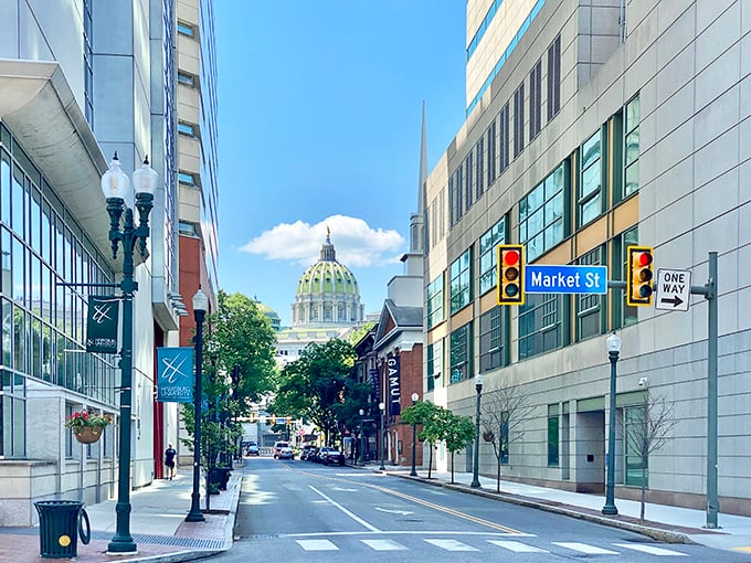 The Pennsylvania State Capitol's green dome watches over a city where affordability meets government grandeur.