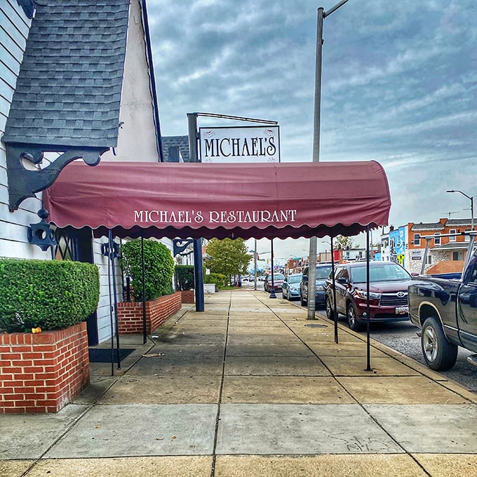 That burgundy awning isn't just for show—it's the gateway to one of Baltimore's most beloved steakhouses where unpretentious charm meets culinary mastery.