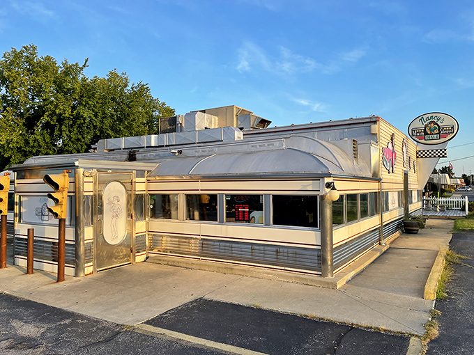 Golden hour at Nancy's Main Street Diner—where vintage vibes and comfort food collide like that '57 Chevy drawing on the wall with your hungry stomach.