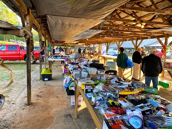 Bargain paradise under rustic wooden beams. Tables overflow with potential treasures waiting to be discovered by eagle-eyed shoppers.