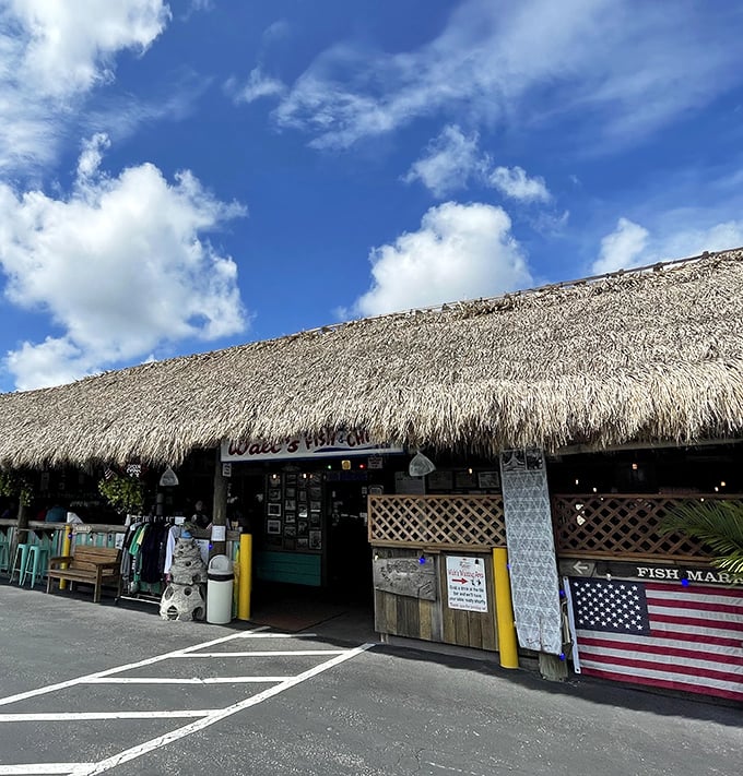 That thatched roof isn't just for show—it's keeping the Florida sunshine at bay while you devour the freshest grouper this side of paradise.