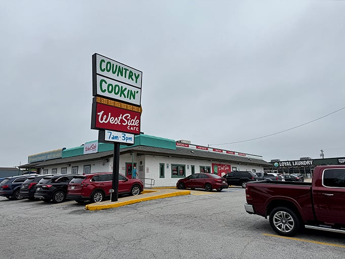 Packed parking lot at West Side Cafe – where locals know breakfast is worth fighting for a spot.