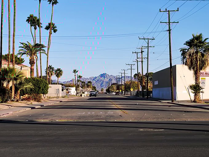 The road stretches toward distant mountains, a daily reminder to Blythe residents that breathtaking natural beauty comes standard with affordable desert living.