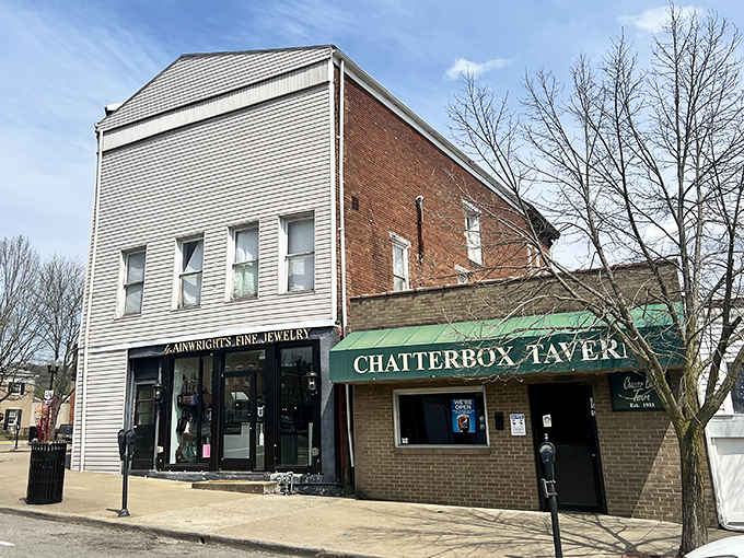 The Chatterbox Tavern sits beside a jewelry store—one feeds your stomach, the other your vanity, both essential services in small-town America.