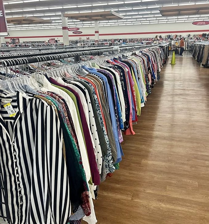 Endless racks of possibility stretch toward the horizon. This isn't just clothing—it's a rainbow-hued expedition of fashion potential.