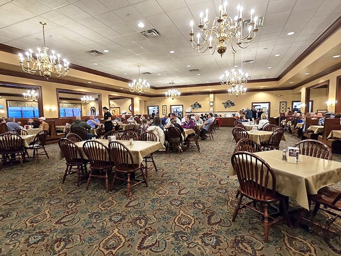 Chandeliers and wooden chairs create an unexpected elegance in this temple of home cooking, where conversations flow as freely as the gravy.