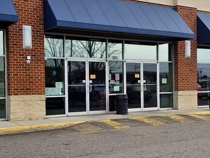Those glass double doors might as well be a portal to another dimension—one where retail therapy doesn't require a credit limit increase.
