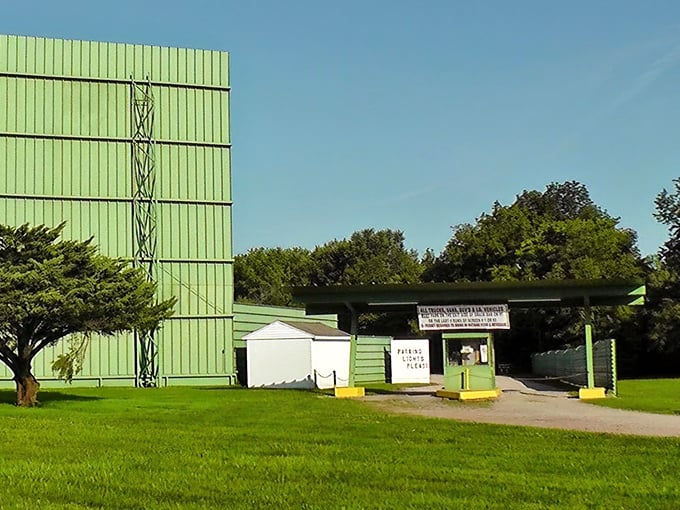 That iconic green screen tower and ticket booth combo – the gateway to nostalgic movie nights under Ohio stars since before Netflix was even a dream.