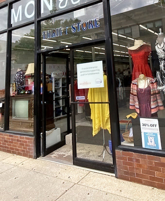 Snow can't keep thrifters away! Monarch's welcoming storefront promises warm treasures inside, with colorful displays beckoning through the glass.