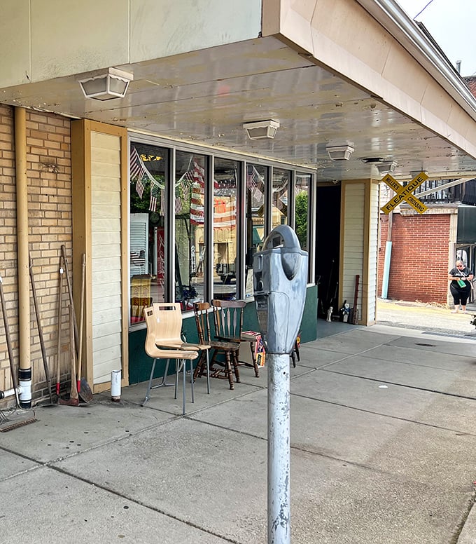 The unassuming entrance belies the wonderland within – those chairs outside aren't just for sale, they're for strategizing your next treasure hunt.