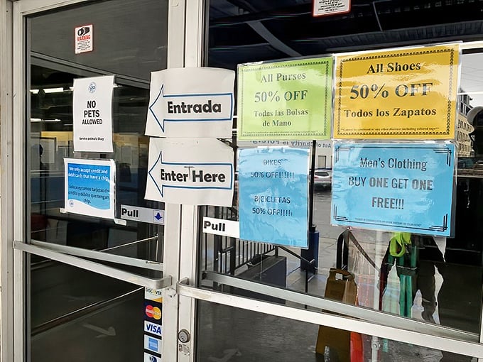 Bilingual welcome signs and colorful discount announcements greet bargain hunters like old friends. The treasure hunt begins here!