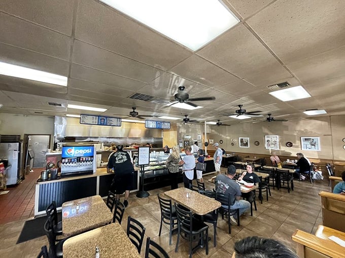 Step inside to a world where ceiling fans gently whirl above hungry patrons eagerly awaiting their handcrafted berrocks and homestyle favorites.