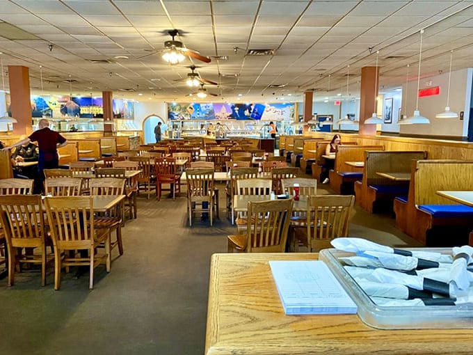 Wooden booths and tables create that classic "stay awhile" atmosphere where food comas are not just expected—they're practically guaranteed.