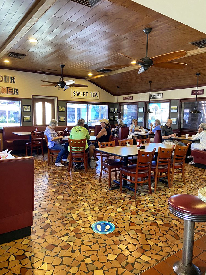 Inside, wooden ceiling fans lazily circulate the aromas of breakfast while the mosaic floor tells stories of countless satisfied diners who came before you.