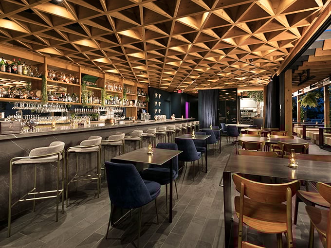 That geometric ceiling isn't just stunning design—it's a conversation starter that'll keep you looking up between bites of Cajun goodness.