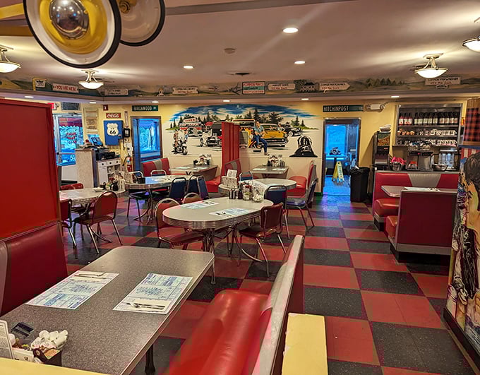 The checkered floor and cherry-red booths aren't retro by design—they're authentic survivors from when diners ruled American highways.