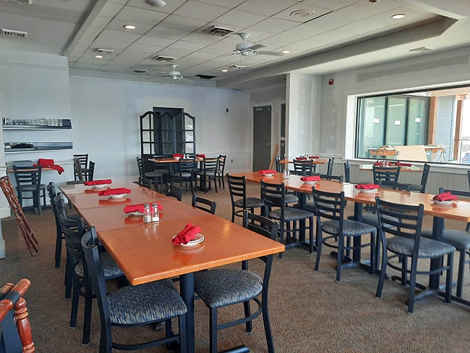Simple elegance with water views that steal the show. Those red napkins aren't just decorative—they're warning flags that you'll never want to leave.