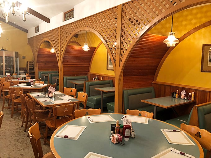 Those wooden lattice dividers aren't just charming design elements—they're privacy booths for when you need to have a serious conversation with your breakfast.