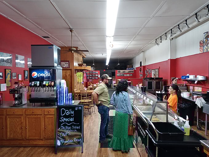 Step inside and time travel begins. Those red walls have witnessed more ice cream-induced joy than a county fair on the Fourth of July.