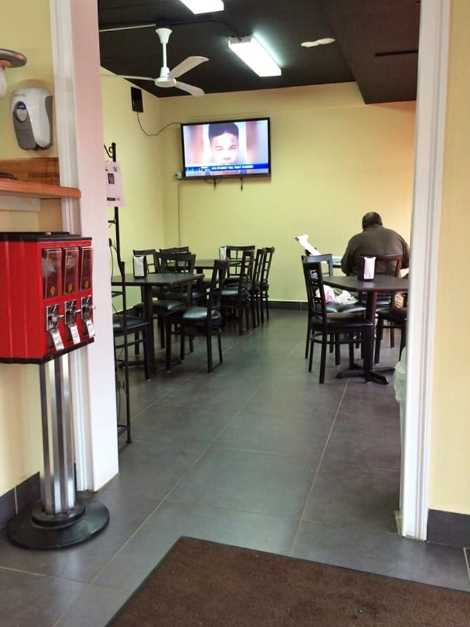 Simple yellow walls and black tables create the perfect backdrop for the star of the show—that legendary pan pizza.