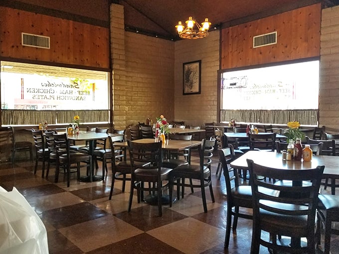 Inside, the checkerboard floors and wood-paneled walls create a time capsule where BBQ traditions are preserved and savored daily.