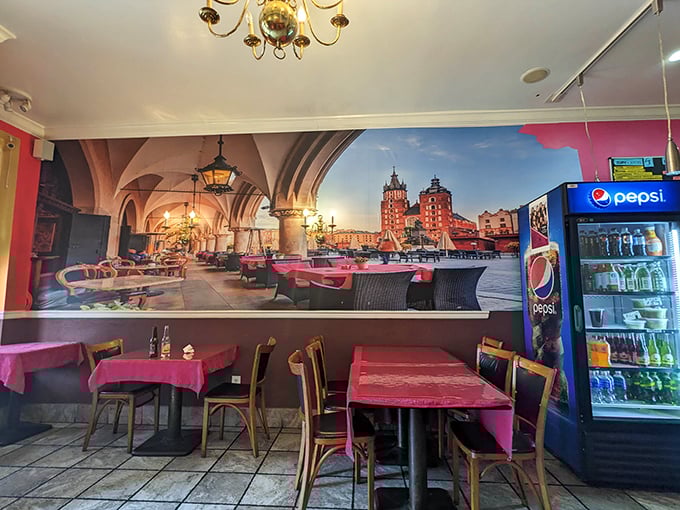 Magenta tablecloths and a sweeping mural of Kraków transform this modest space into a Polish postcard come to life.