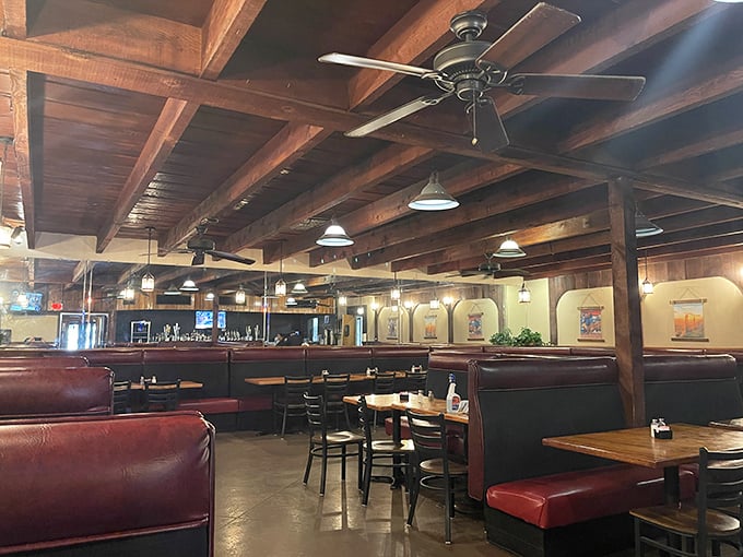 Wooden beams and red leather booths – the universal language of "serious steak is served here." Comfort never goes out of style.