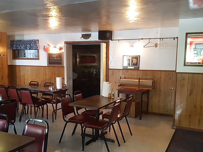 Wood-paneled walls and no-nonsense red vinyl chairs tell you immediately: this place prioritizes what's on your plate, not what's on the walls.