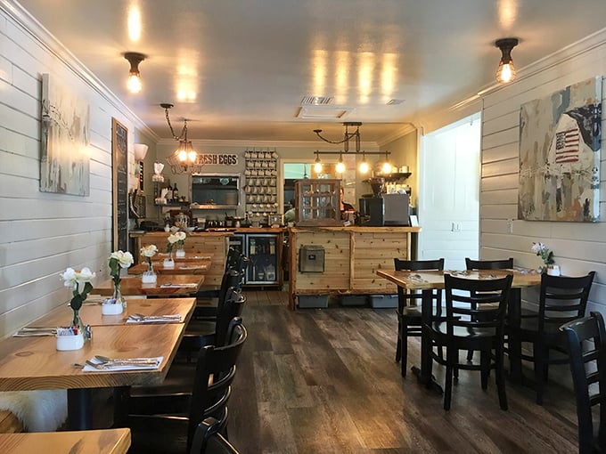 Warm wood tones and white shiplap create that perfect "farmhouse meets fine dining" vibe where comfort and culinary excellence share equal billing.