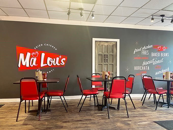 Simple yet stylish, the interior's gray walls and red chairs create the perfect backdrop for the real star—that chicken you're about to devour.