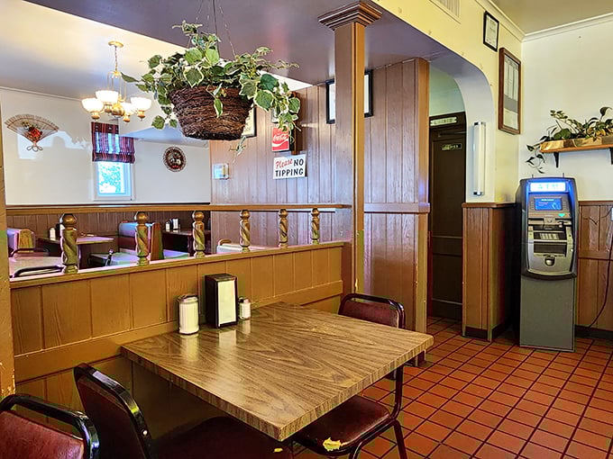 Wood paneling, hanging plants, and booths worn to perfection by decades of happy diners. This isn't decoration—it's a time capsule of American dining.