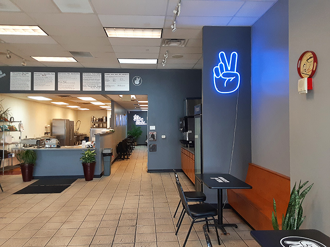 That blue neon peace sign isn't just decor—it's a promise of the harmony your taste buds will experience once you've ordered.