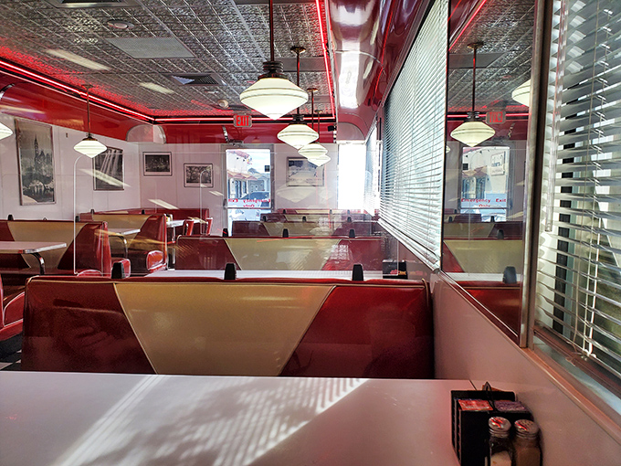 Red vinyl booths and pressed tin ceilings transport you to simpler times. This isn't retro by design—it's the authentic article, preserved like a delicious time capsule.