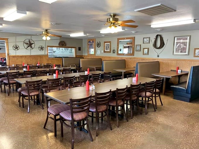 Classic Americana lives in this dining room where wood paneling, metal stars, and comfortable seating create the perfect backdrop for serious eating business.