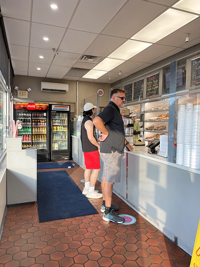 The anticipation builds as customers wait their turn at the counter. Some life decisions are worth contemplating – chocolate glazed or apple fritter?