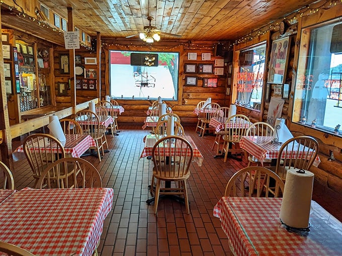 Step inside and time slows down – wooden paneling, checkered tablecloths, and Windsor chairs create the perfect backdrop for serious barbecue contemplation.