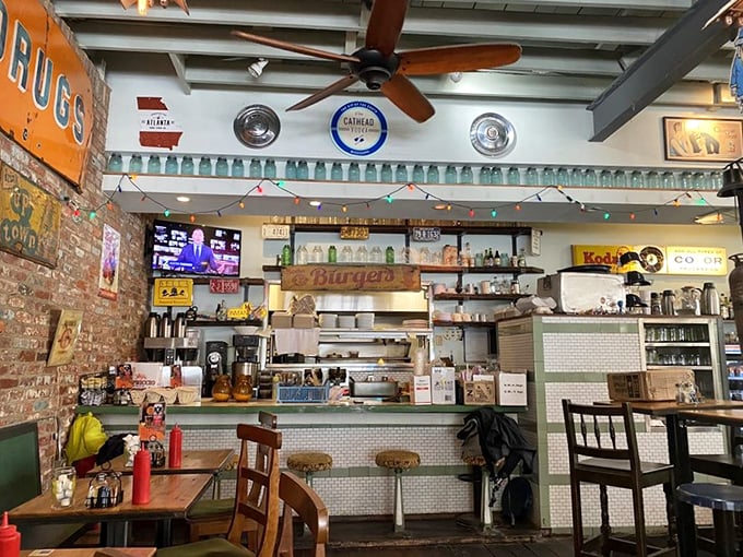 Vintage signs, exposed brick, and an open kitchen create that perfect "where everybody knows your name" vibe—minus Norm, but with much better breakfast options.