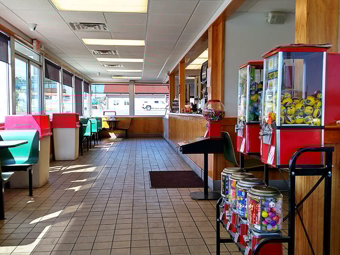 Nostalgia served daily alongside the food – candy machines and simple seating create that perfect "come as you are" atmosphere.