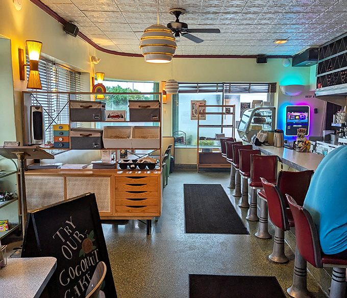 Step inside and suddenly you're in the diner of your dreams—pressed tin ceiling, vintage light fixtures, and those red counter stools practically begging for your company.