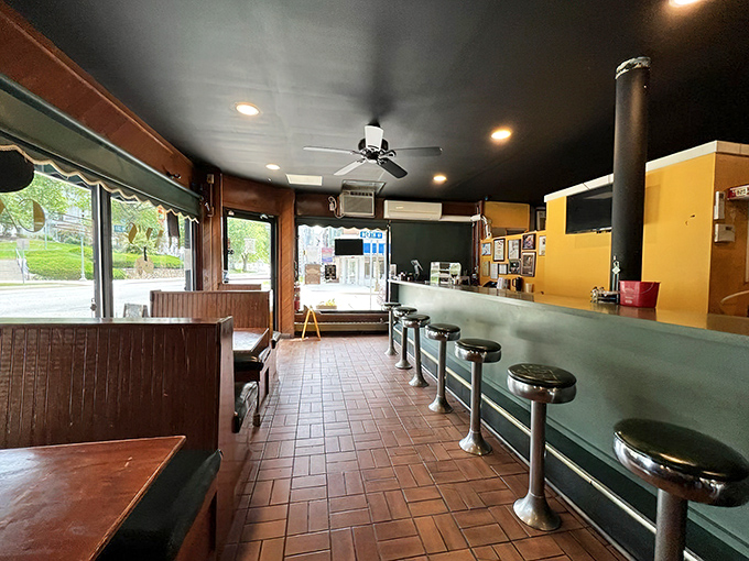 The classic diner interior features those spinning counter stools that make everyone feel like they're eight years old again, no matter what their driver's license claims.
